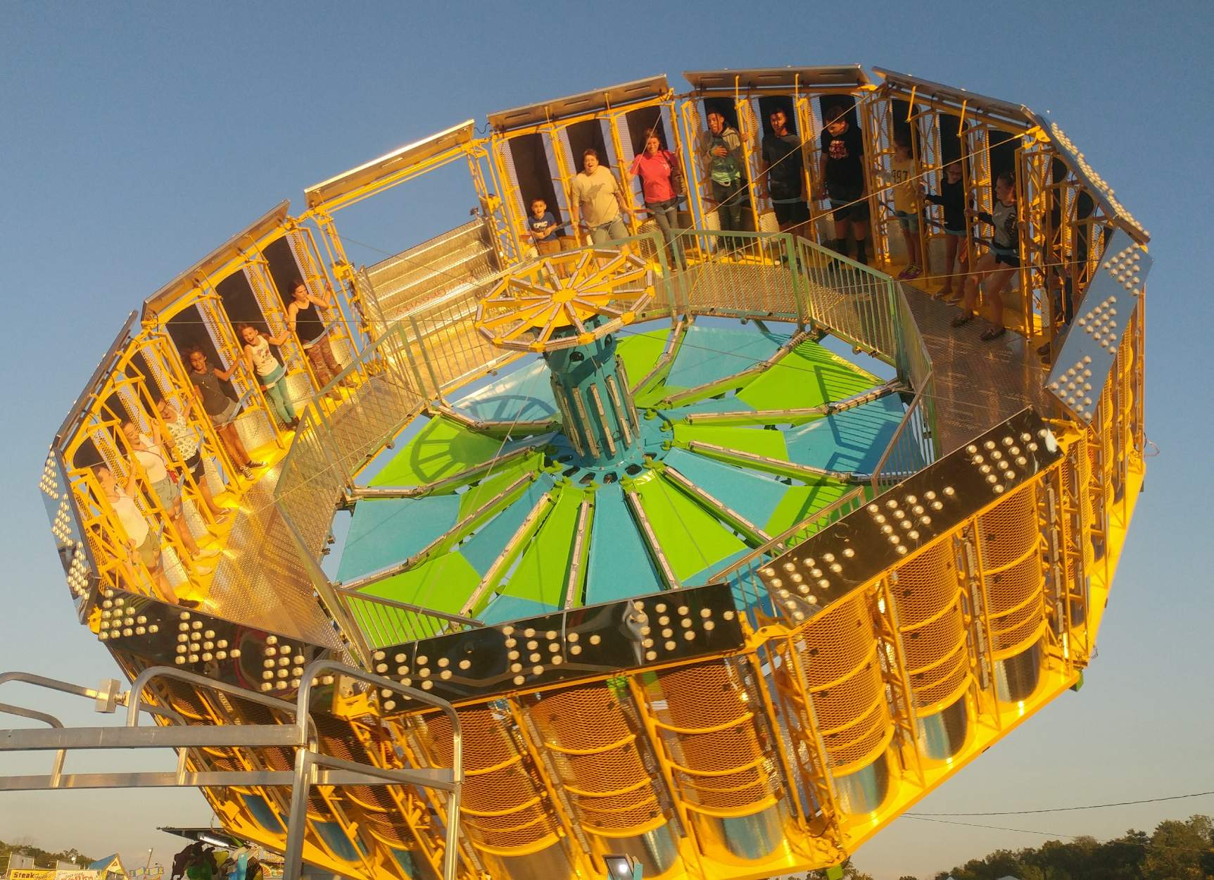 Solve Tilt-a-whirl at the fair jigsaw puzzle online with 150 pieces