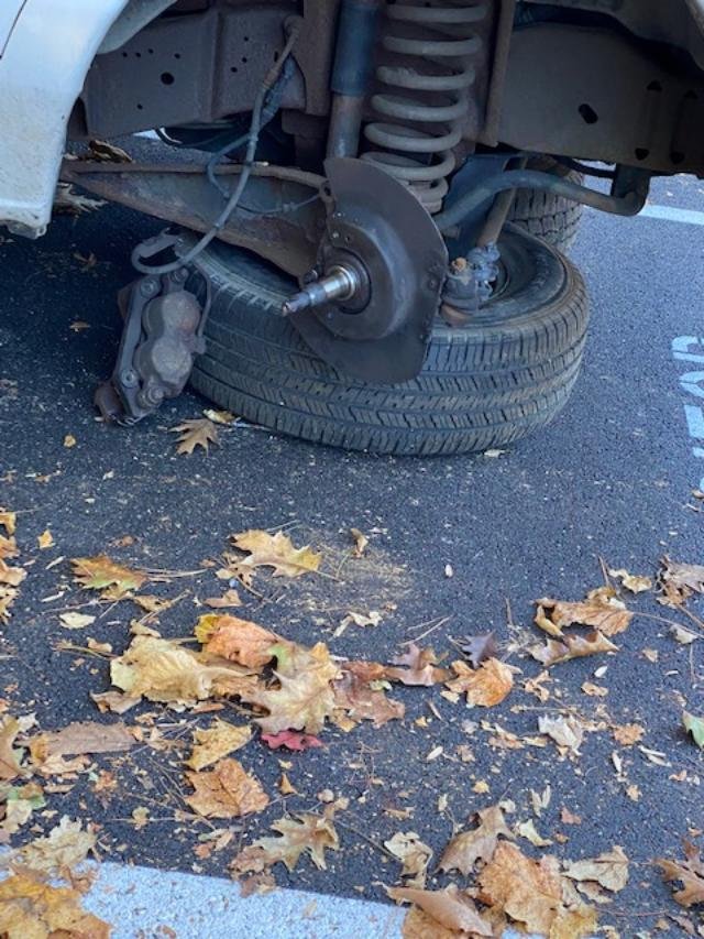 Solve Two front tires under the van jigsaw puzzle online with 20 pieces