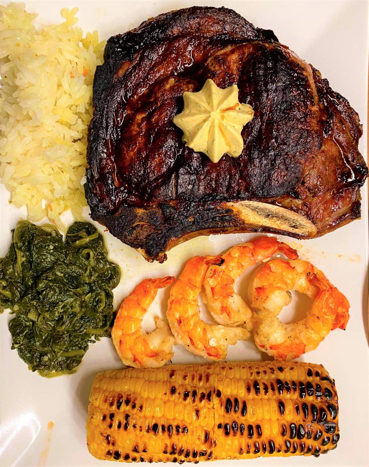 Solve Charcoal-grilled surf and turf dinner - Ribeye steak with herb ...