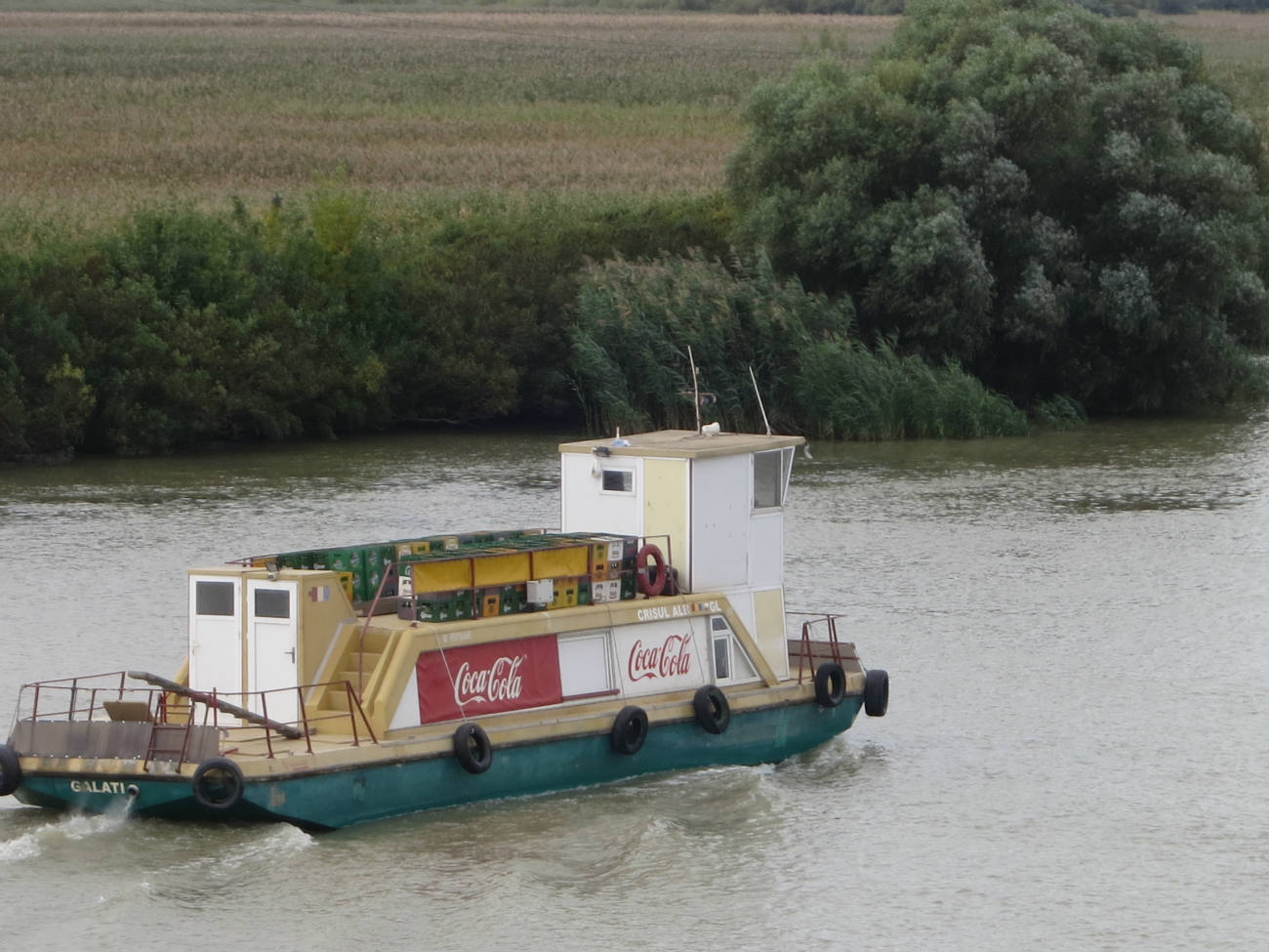 Solve coca cola delivery boat jigsaw puzzle online with 130 pieces
