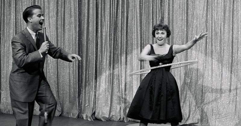 Solve 1958 Dick Clark and hula hoop jigsaw puzzle online with 45 pieces