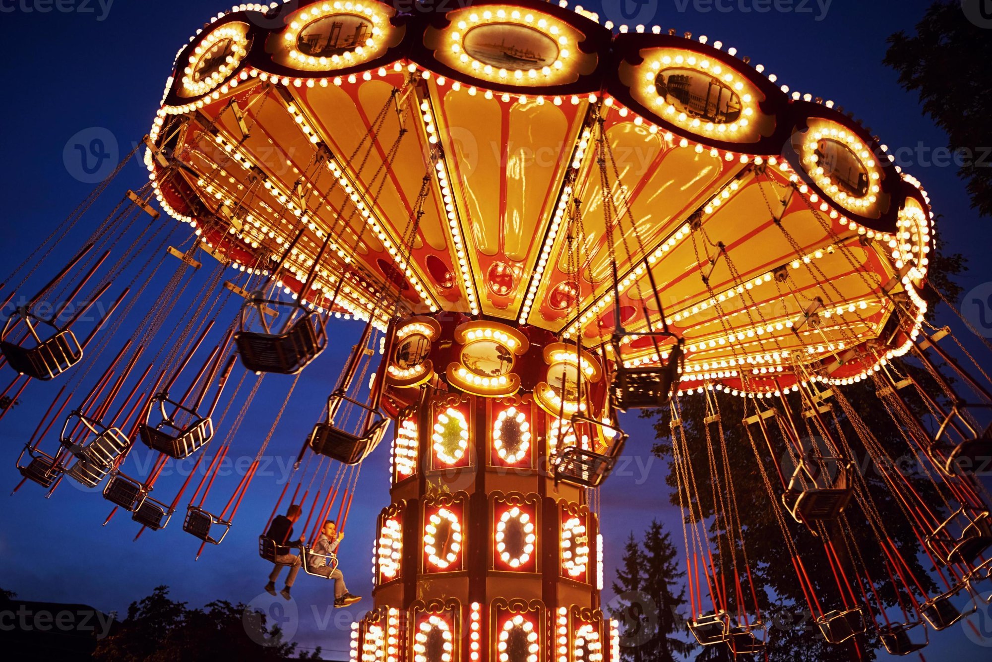 Solve Carousel Merry-go-round in amusement park at night jigsaw puzzle ...