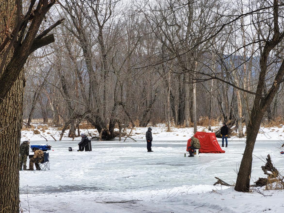 Solve Ice fisher-people on a Mississippi River slough jigsaw puzzle ...