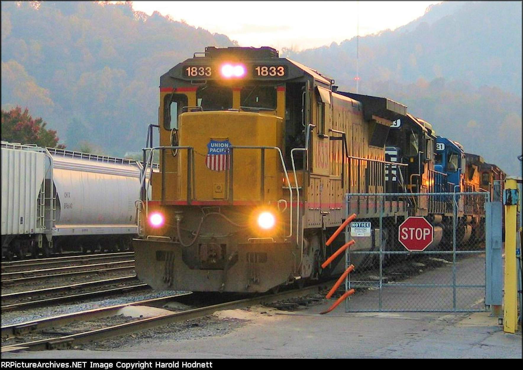 Solve UP 1833 heads up a string of locos as darkness falls in Canton jigsaw puzzle online with ...