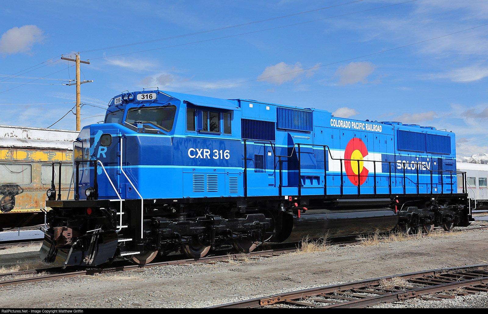 Solve A very blue locomotive makes its debut in fresh paint under a ...