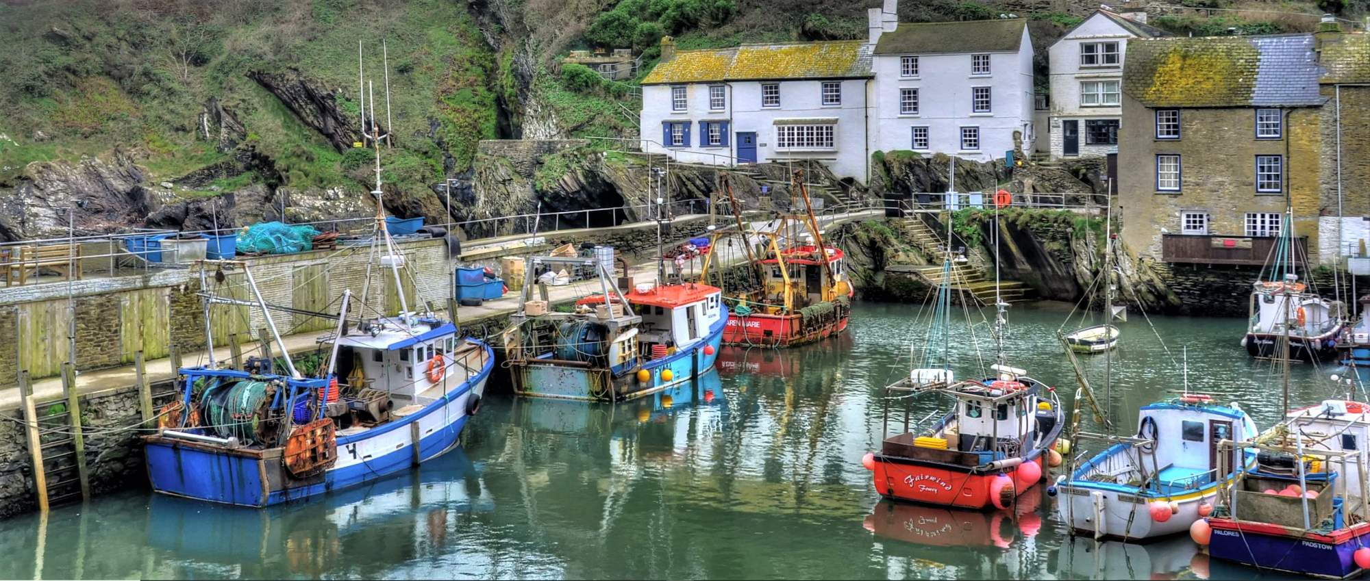 Solve Fishing boats moored at Polperro harbour in Cornwall, England ...
