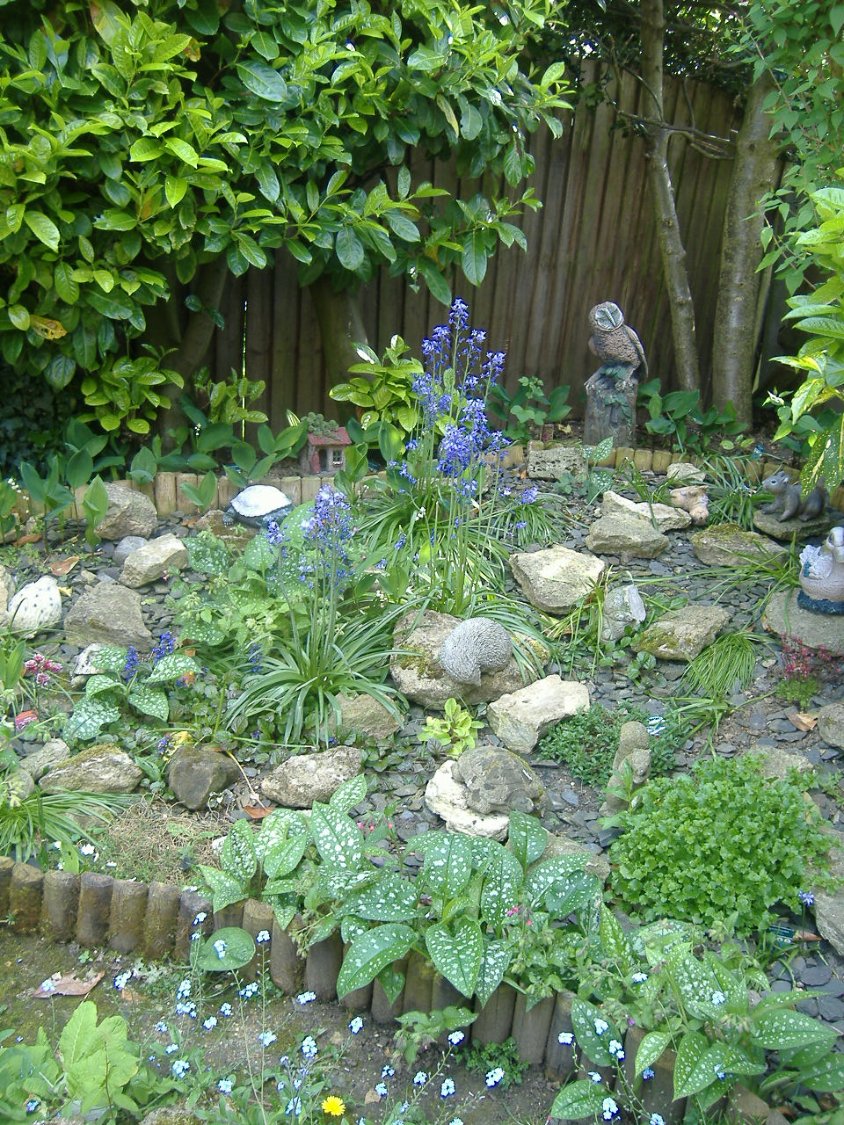 Solve Seasonal - Spring - Garden - Rockery With Bluebells, Ornaments ...
