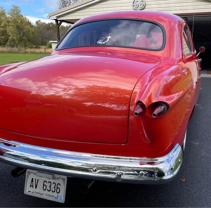 Solve 1951 Ford with dual '59 Caddy tail lights red jigsaw puzzle online with 81 pieces