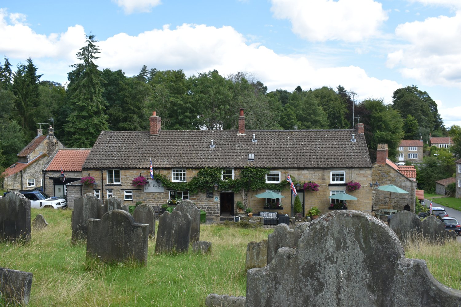 Solve View from Lastingham church to village and the Blacksmiths Arms ...