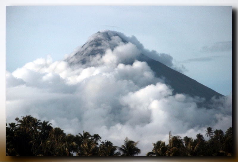 Solve Mt. Mayon Clad in Clouds jigsaw puzzle online with 12 pieces