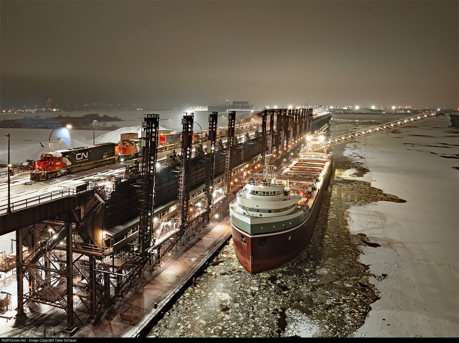 Solve An Ore Freighter is being loaded at a dock "...on the lake that ...
