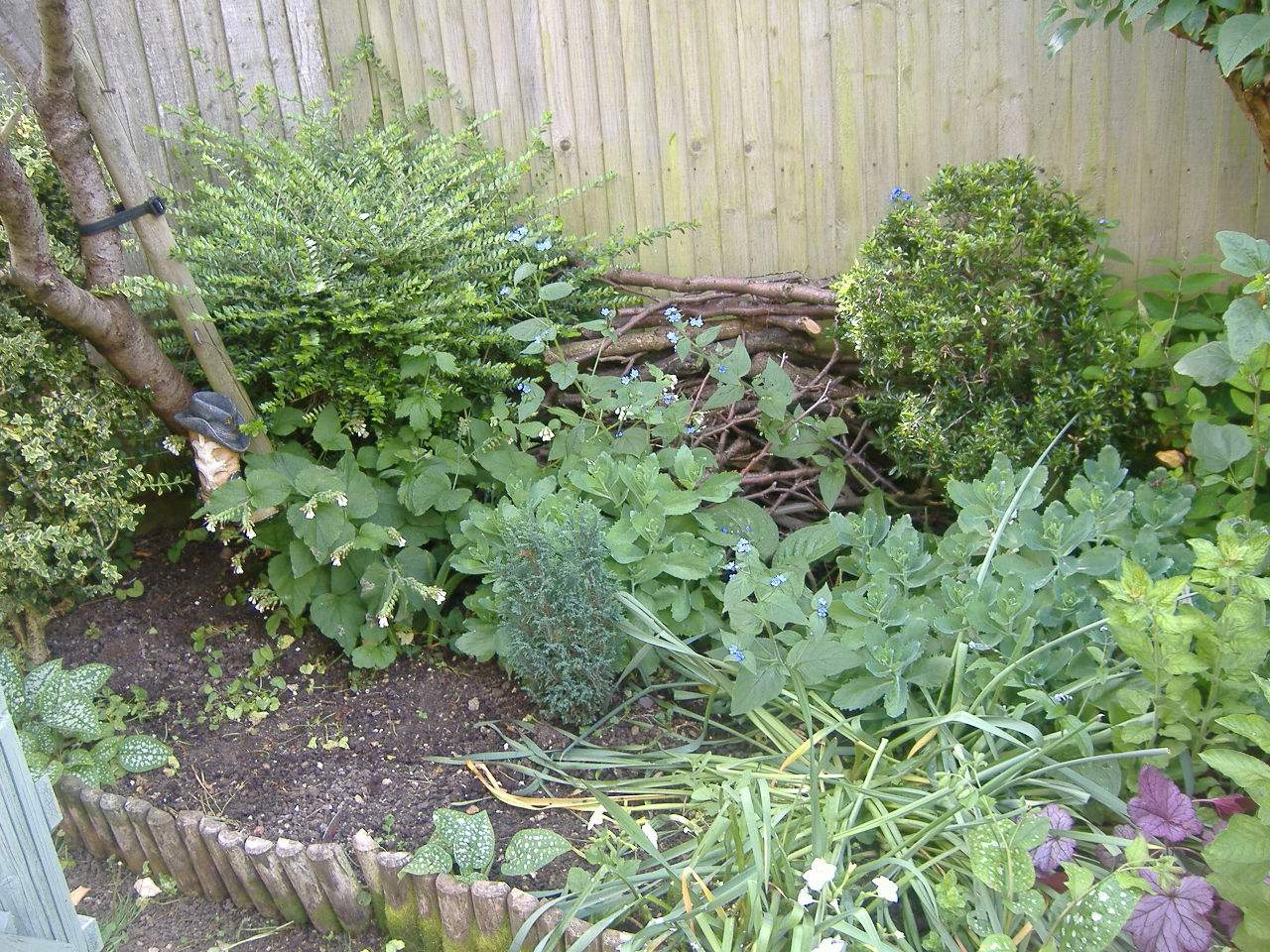 Solve Nature - Garden - Log Pile jigsaw puzzle online with 108 pieces