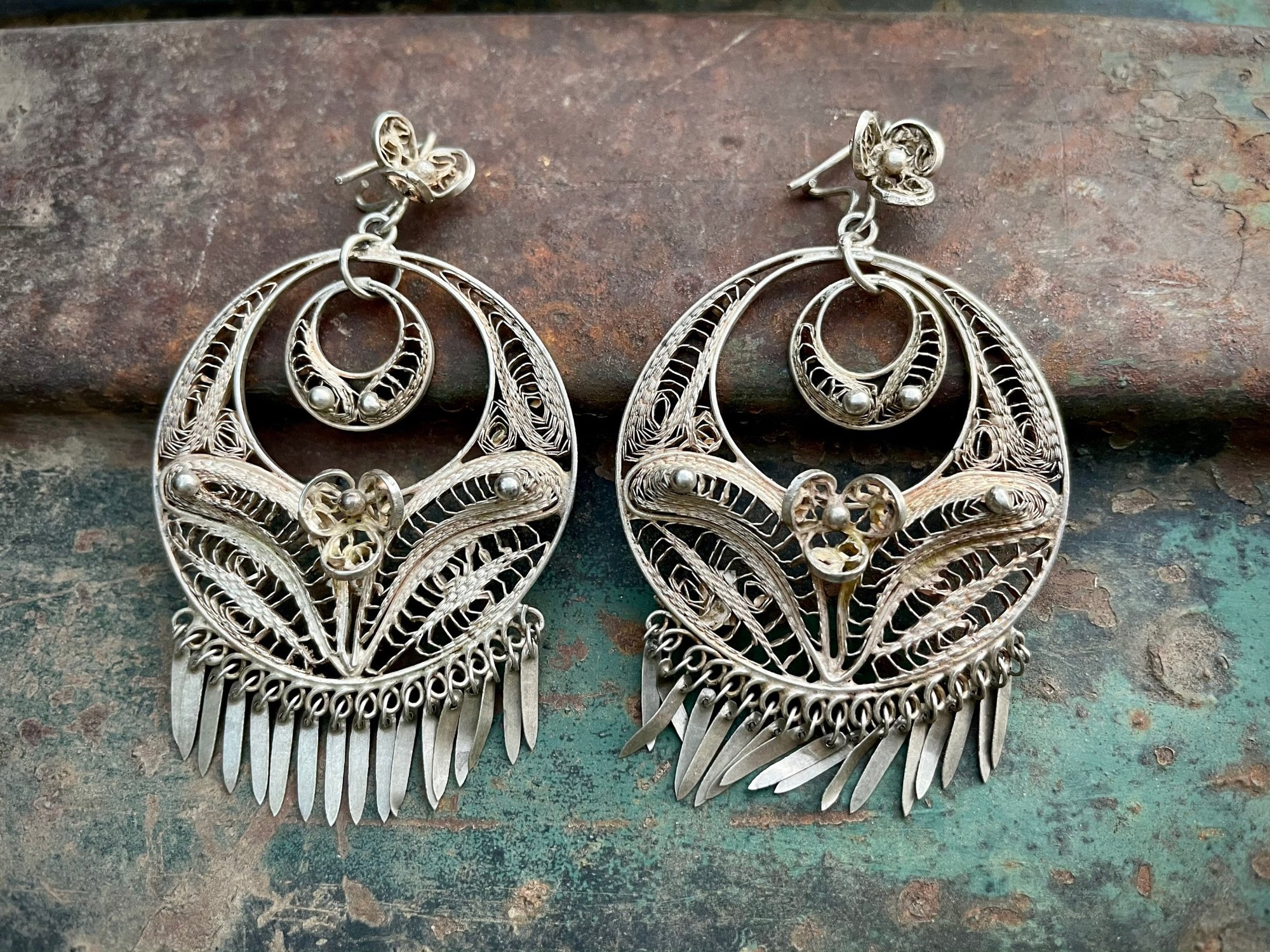 Solve Silver filigree earrings jigsaw puzzle online with 108 pieces