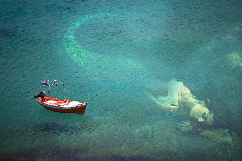 Solve resting giant mermaid jigsaw puzzle online with 54 pieces