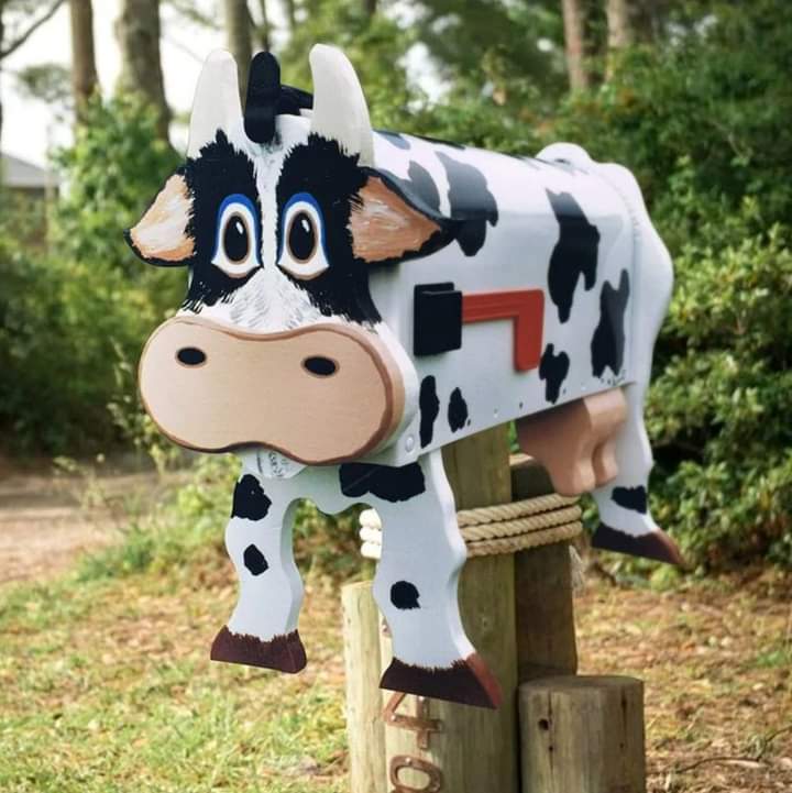 Solve Cow Letterbox jigsaw puzzle online with 25 pieces