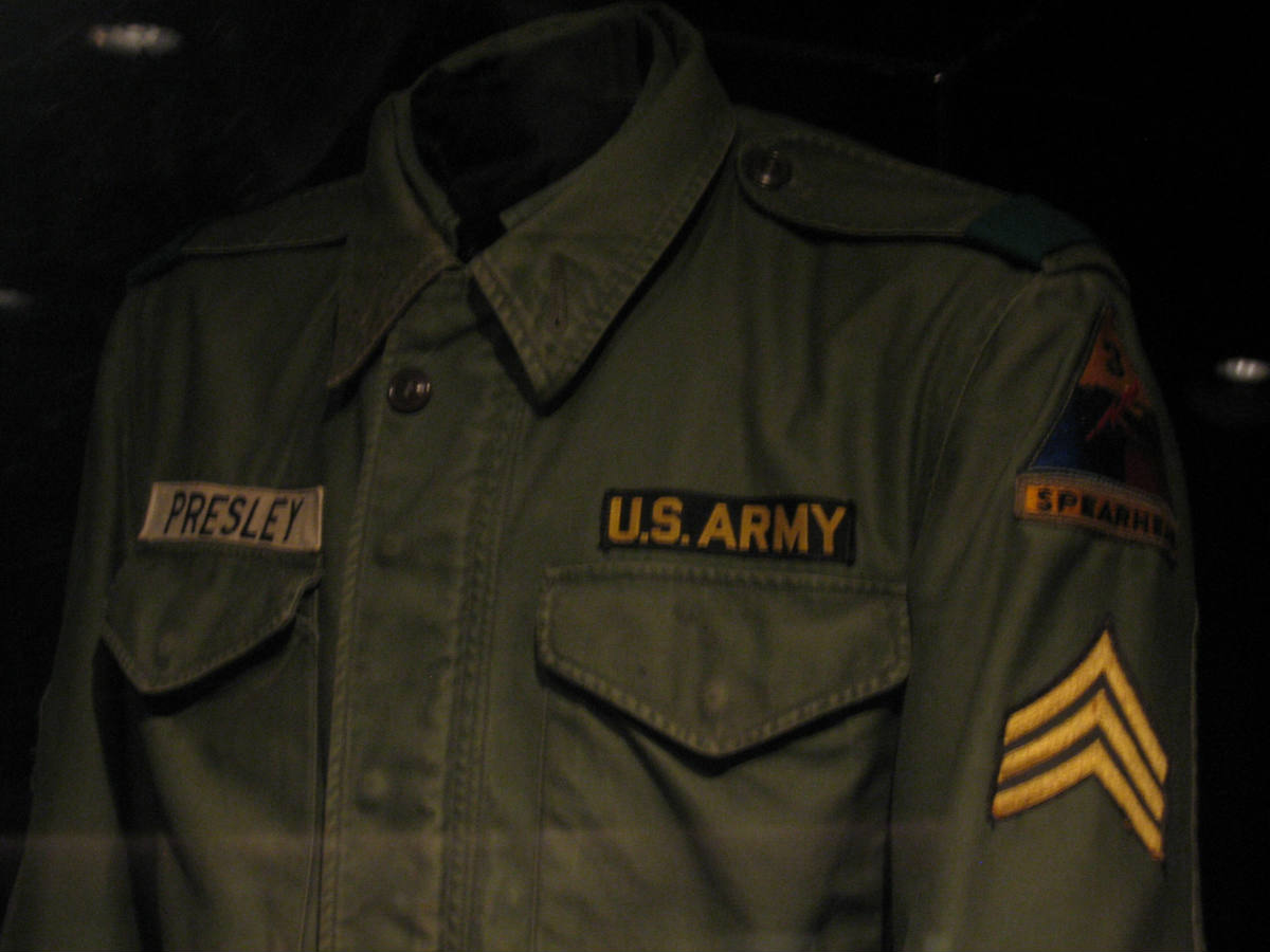 Solve Elvis Presley US Army jacket jigsaw puzzle online with 63 pieces