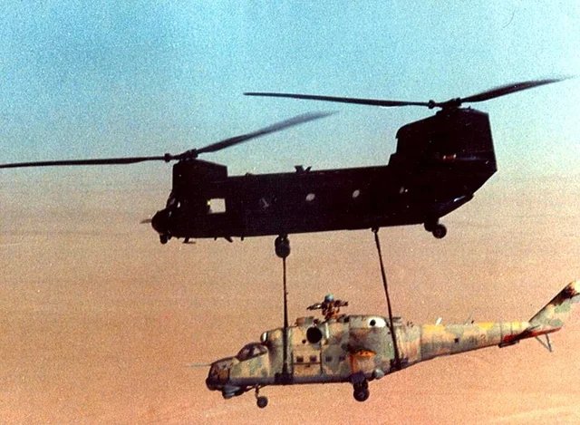 Solve MH-47 Chinook carrying a captured Libyan Mi-25 during operation ...