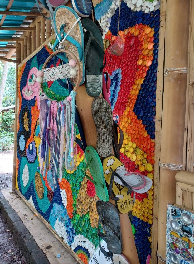 Solve The Recycling Center - wall mural of colored plastic bottle tops ...