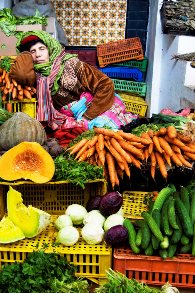 Solve A Sleeping Market Stall Lady jigsaw puzzle online with 70 pieces