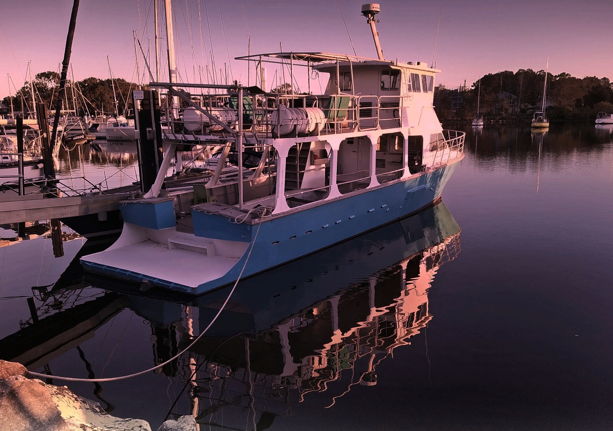 Solve Boat Reflections jigsaw puzzle online with 70 pieces