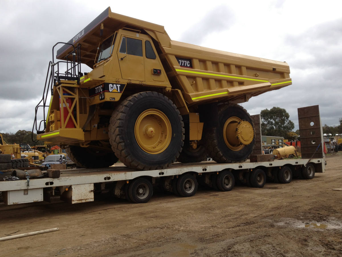 Solve Cat 777C Dumper Being Transported to Mine jigsaw puzzle online ...