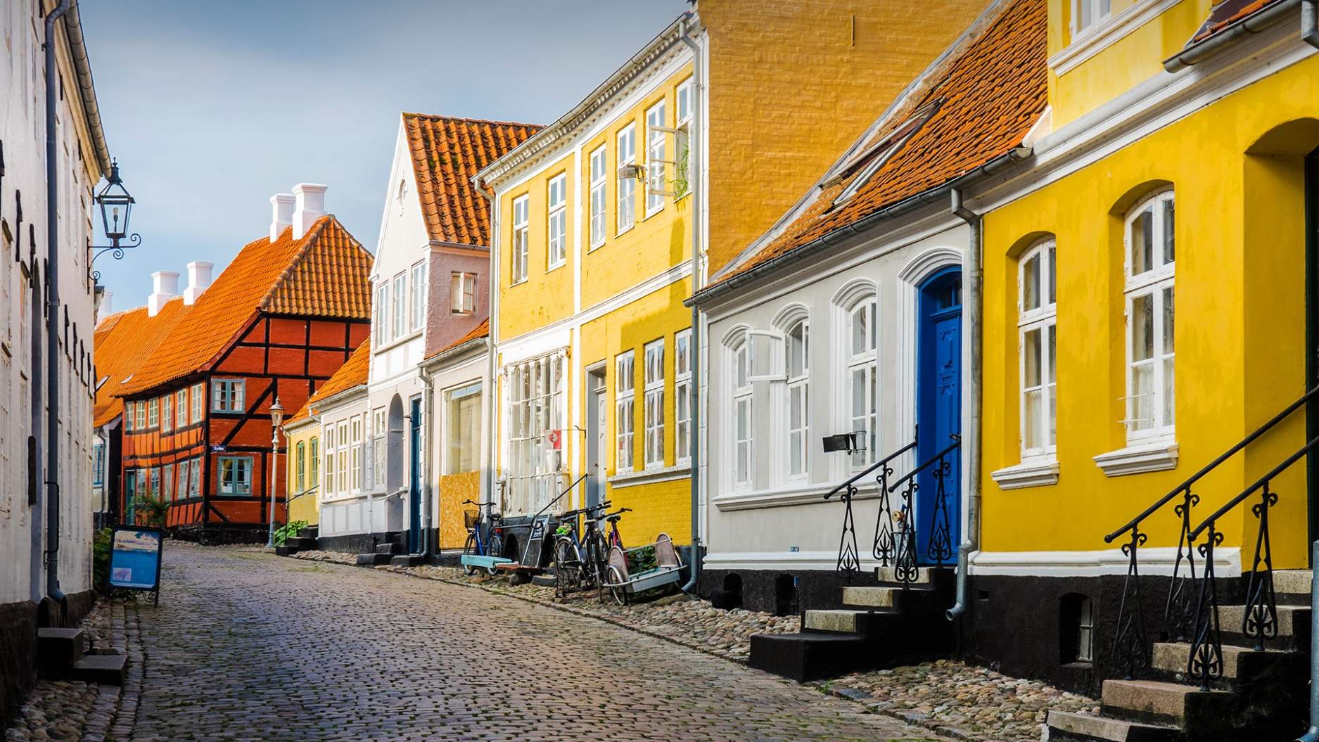 Solve Brightly painted houses on cobbled street in Ærøskøbing, island ...