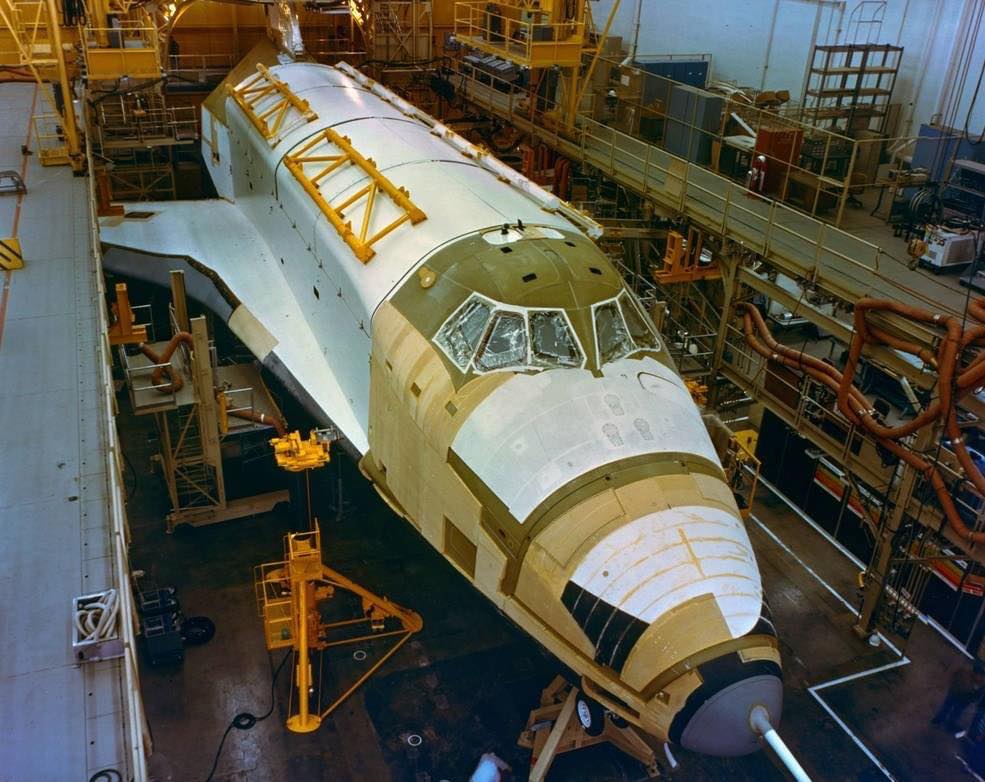 Solve A Space Shuttle getting preflight maintenance. The nose probe ...