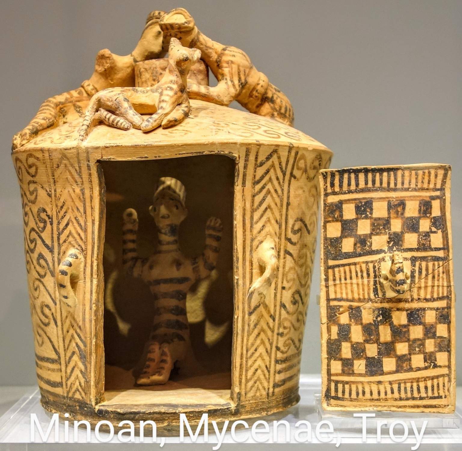 Solve A circular shrine-model containing the figurine of a goddess of ...