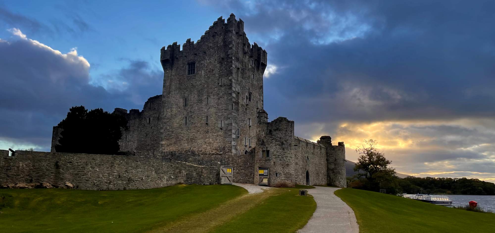 Solve Sunset at Ross Castle, Killarney jigsaw puzzle online with 364 pieces