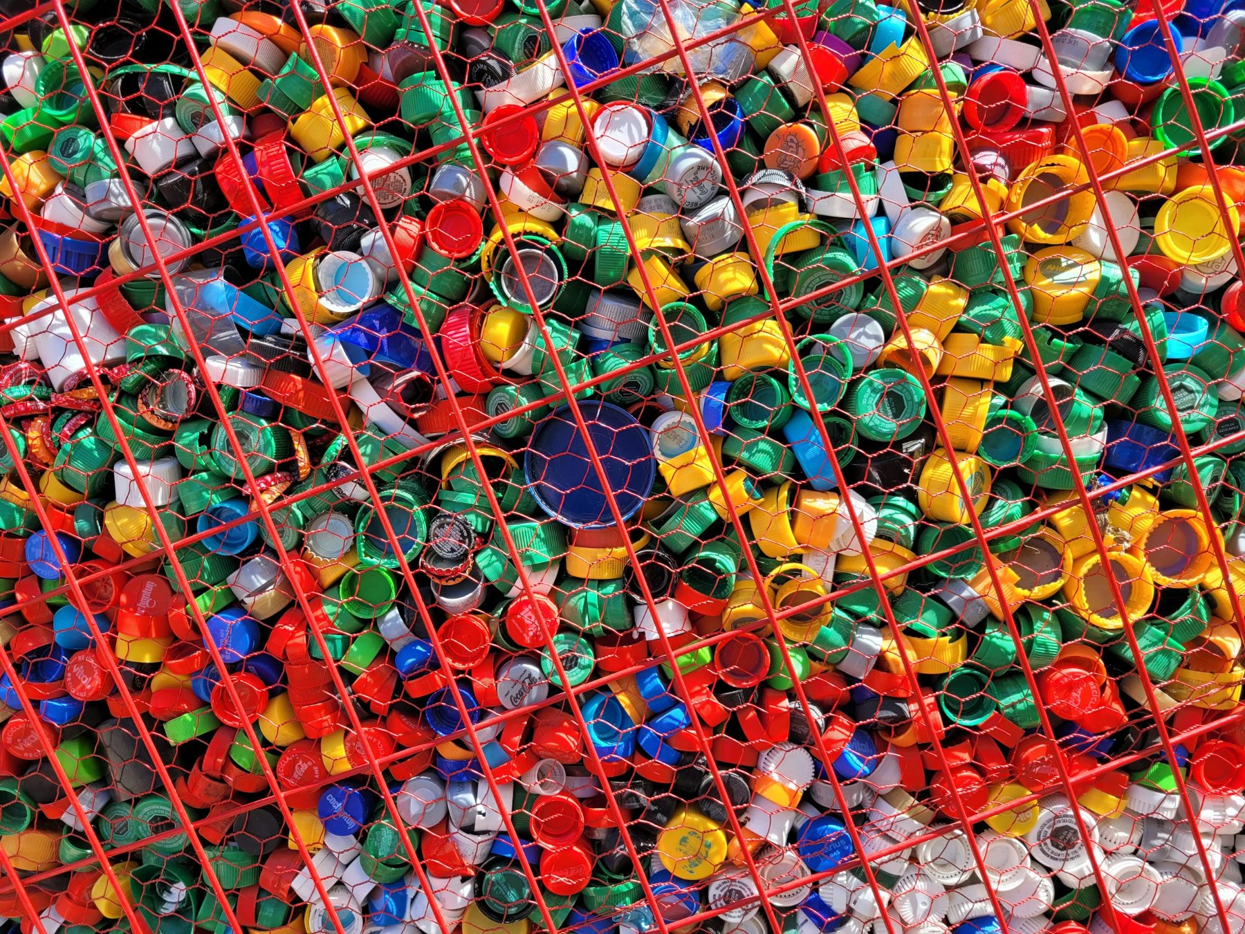 Solve Plastic bottle caps being recycled jigsaw puzzle online with 63 ...